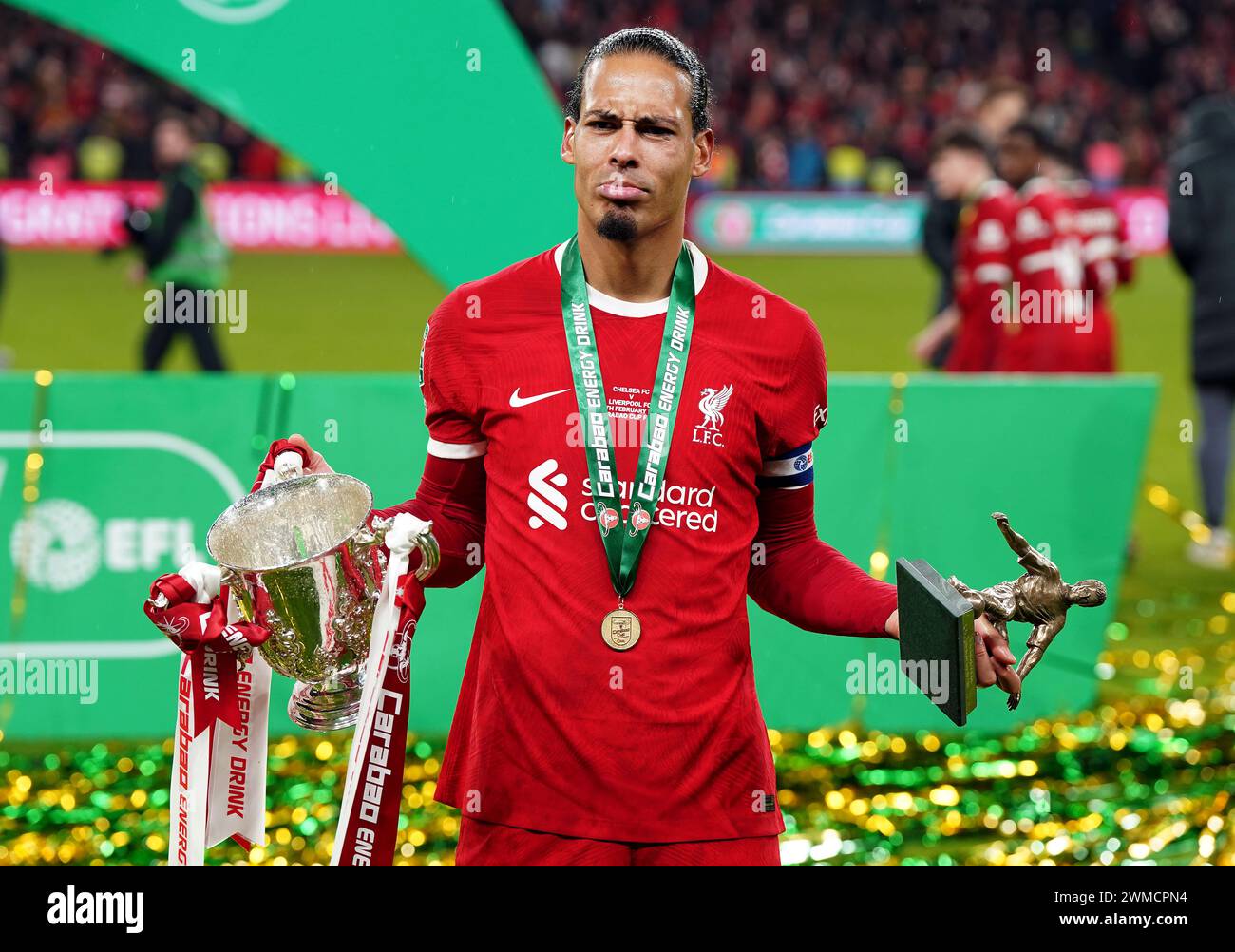 Liverpool's Virgil van Dijk with the trophy after winning the Carabao ...