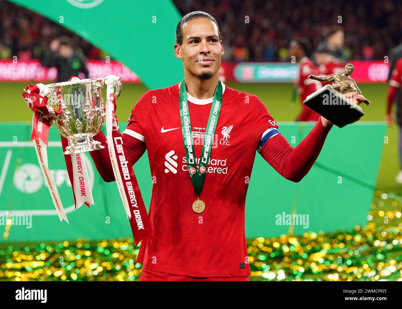 Liverpool's Virgil van Dijk with the trophy after winning the Carabao ...