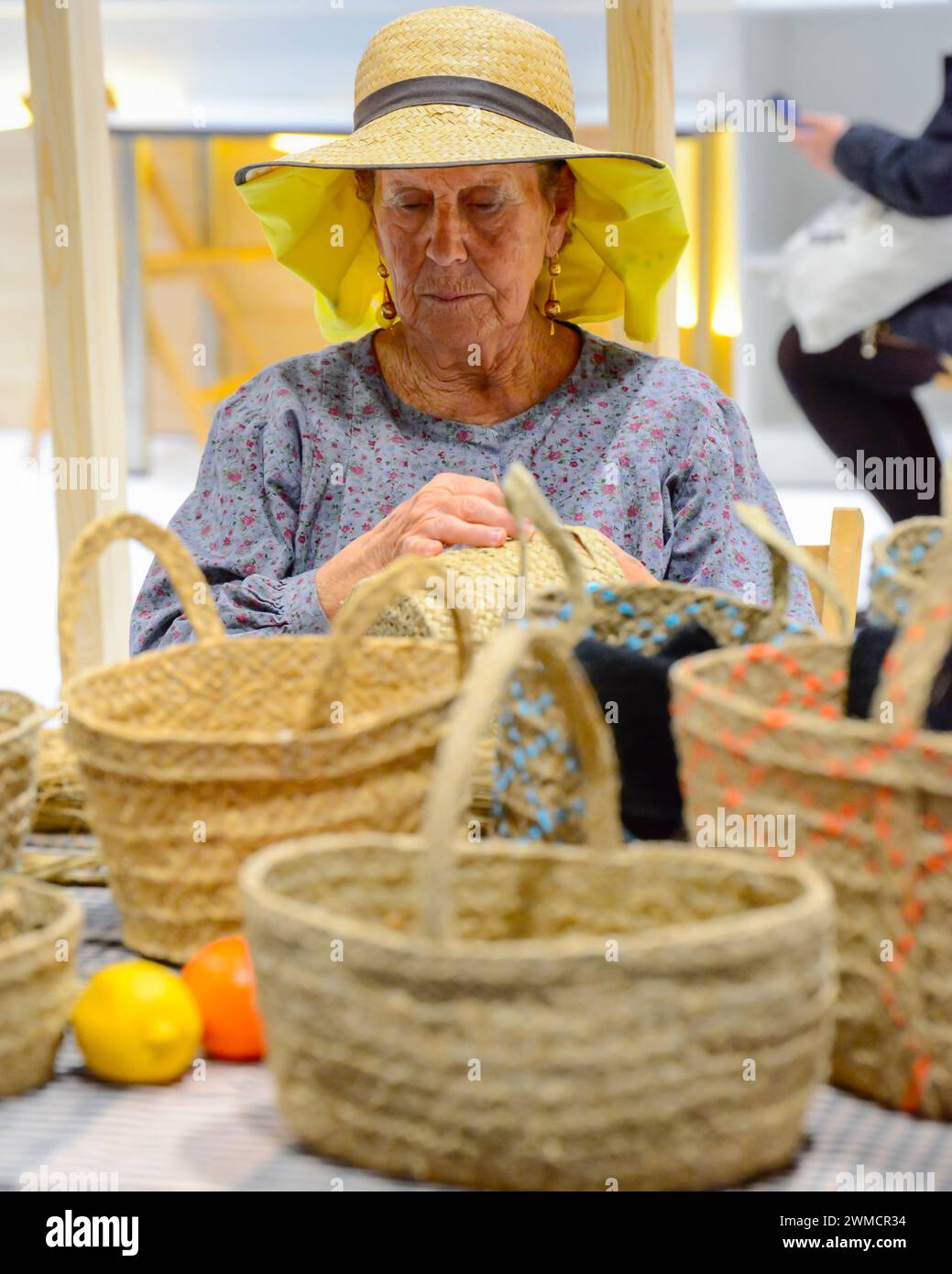 A portrait of a woman basket weaving showing skills in handicrafts from ...