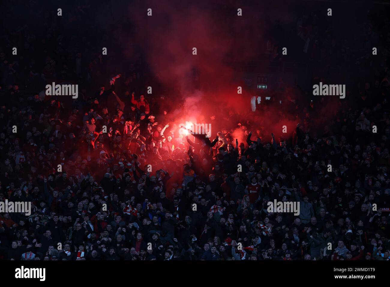 London, UK. 25th Feb, 2024. Liverpool fans with flares as they ...