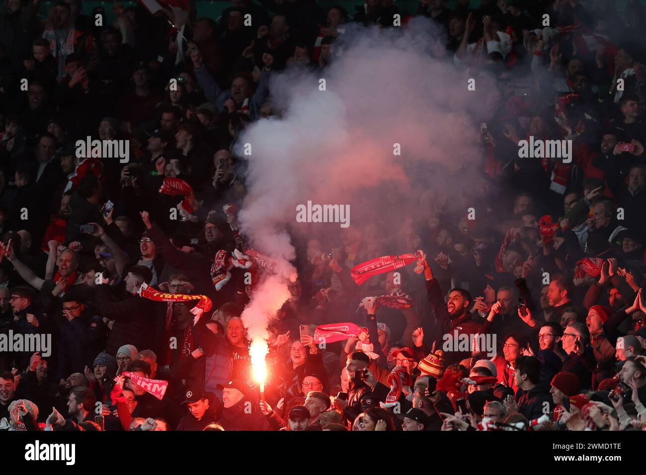 London, UK. 25th Feb, 2024. Liverpool fans with flares as they ...