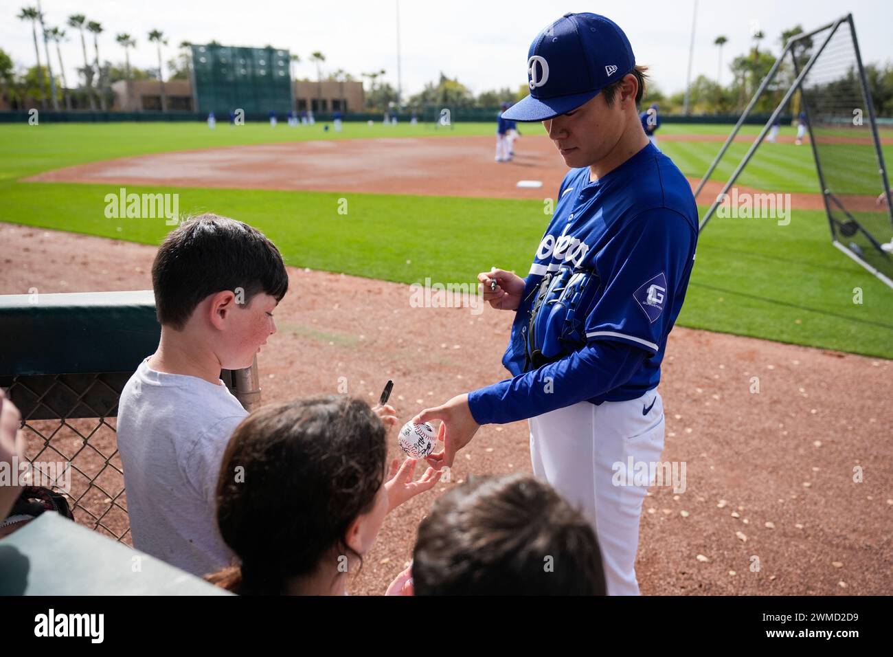 Los Angeles Dodgers starting pitcher Yoshinobu Yamamoto signs ...
