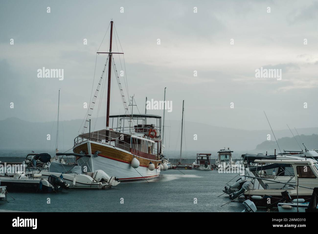 Sloop rigged sailboats moored to pier in yacht marina, Biograd na Moru ...