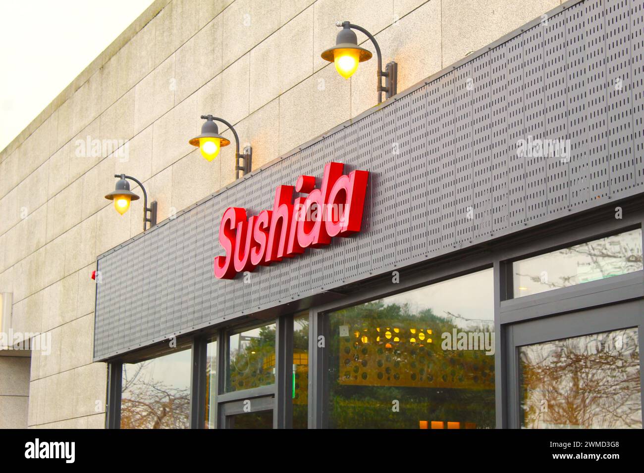 Dublin, Ireland - February 24th 2024: A photo of a red Sushida restaurant logo on the exterior ...