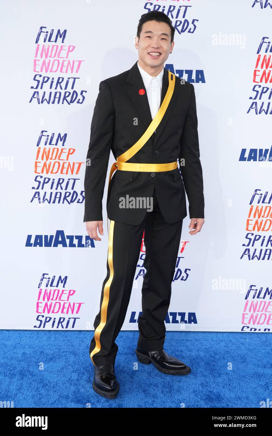 Joel Kim Booster arrives at the Film Independent Spirit Awards on ...