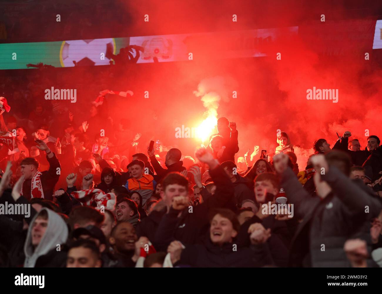 London, UK. 25th Feb, 2024. Liverpool fans lights a flare in the stands ...