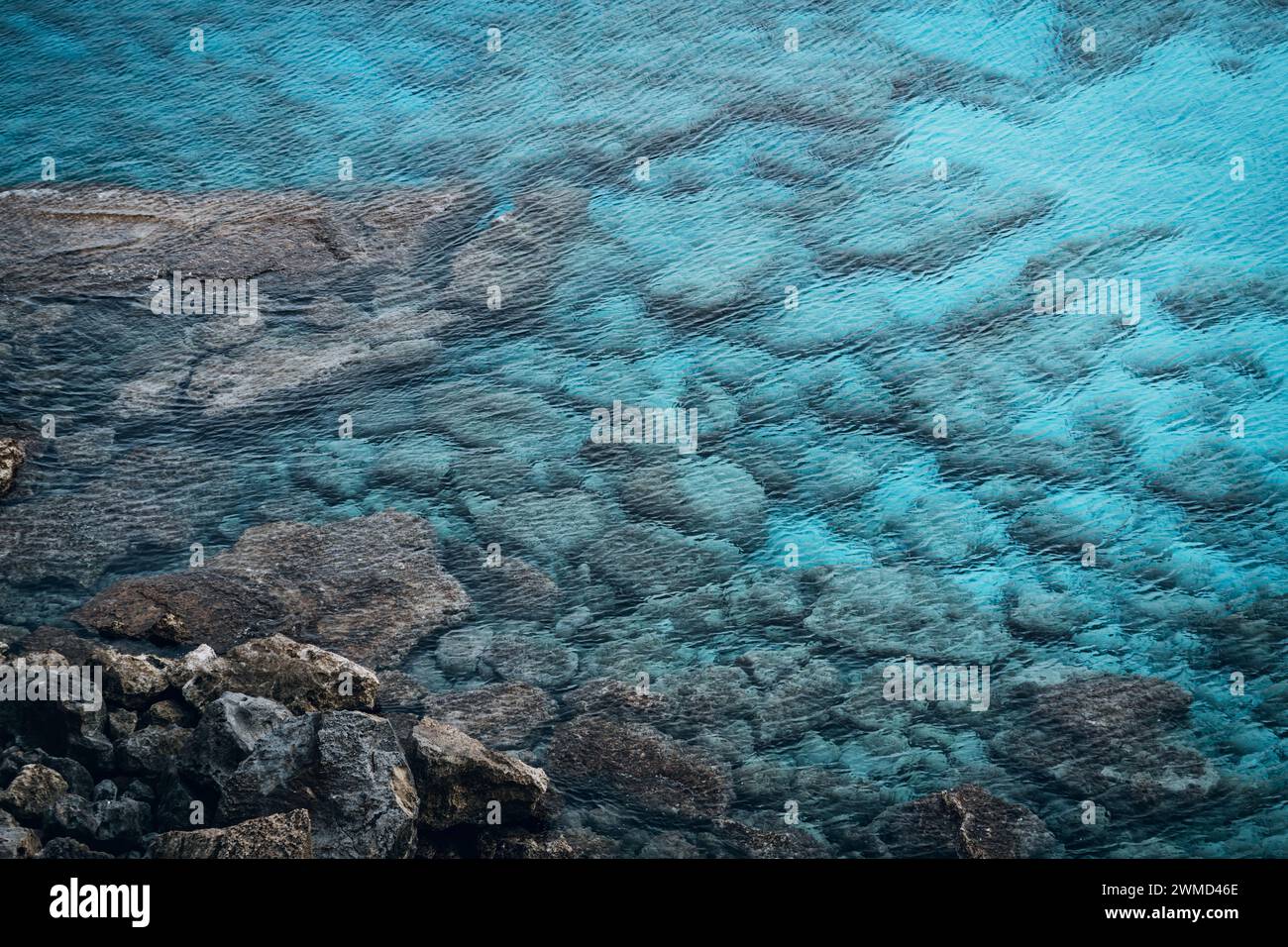 Top view of stones and rocks underwater, rocky sea beach in Cape Greco ...