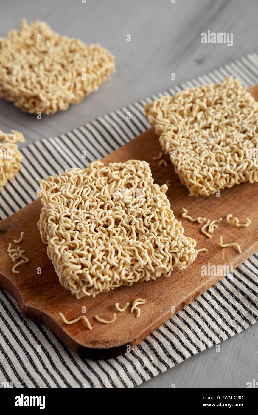 Dry Ramen Noodles on a wooden board, side view Stock Photo - Alamy