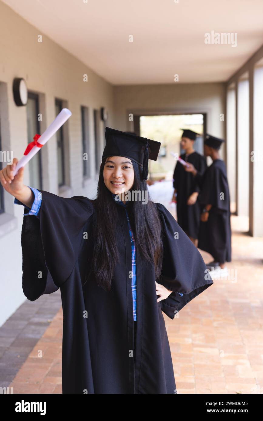 Proud Asian girl celebrates graduation Stock Photo - Alamy