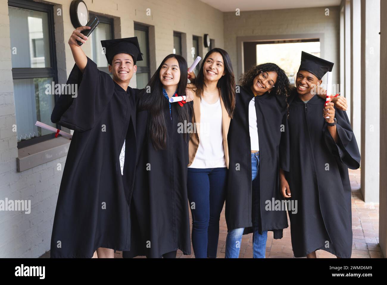 Diverse group of graduates celebrate their achievement Stock Photo - Alamy