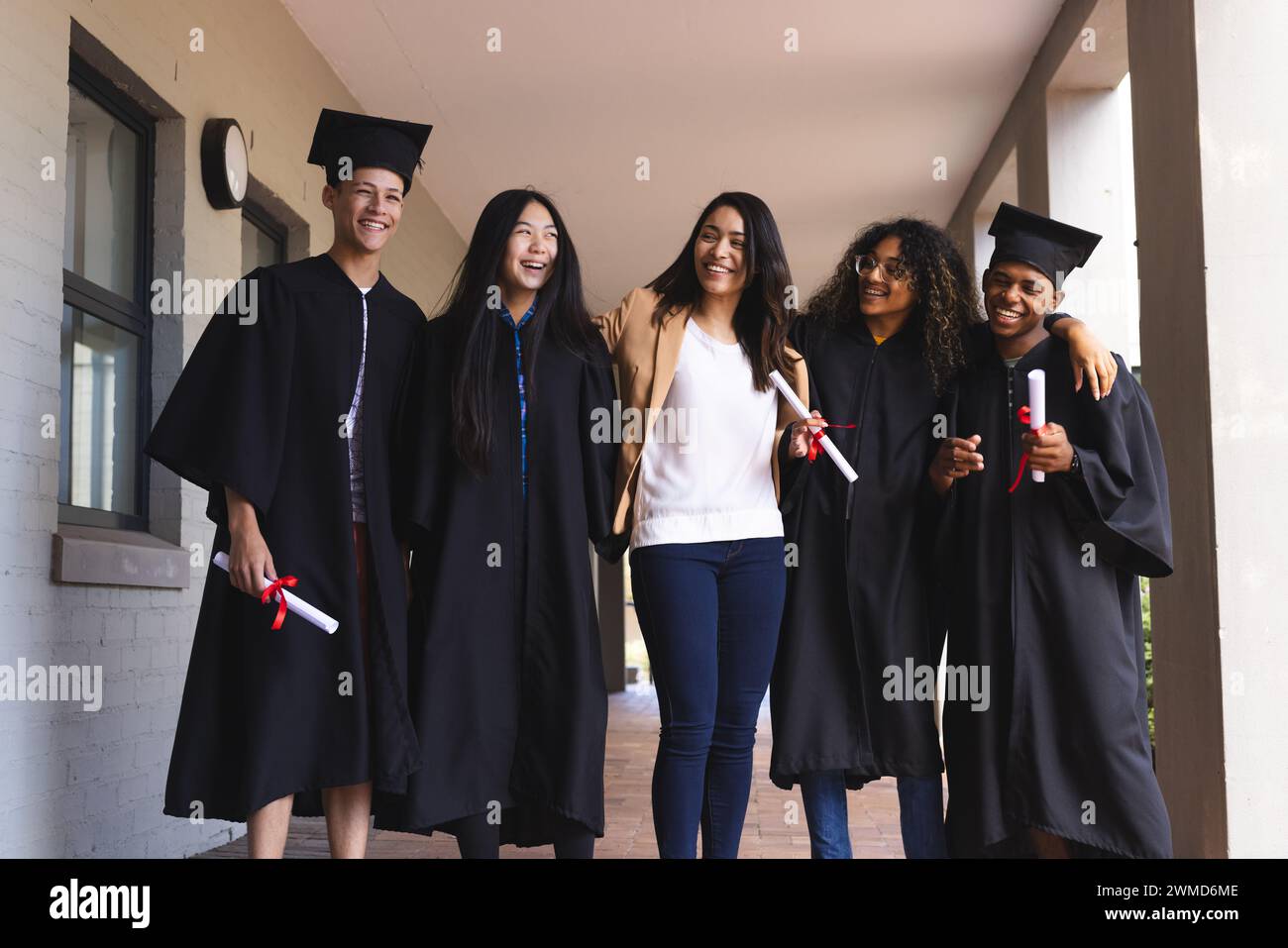 Diverse group of graduates celebrate their achievement Stock Photo - Alamy