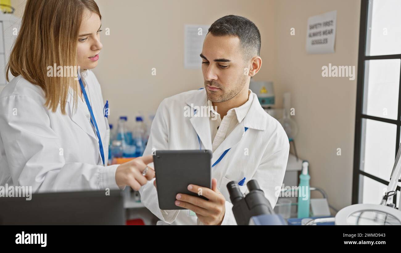Laboratory collaboration microscope tablet hi-res stock photography and ...