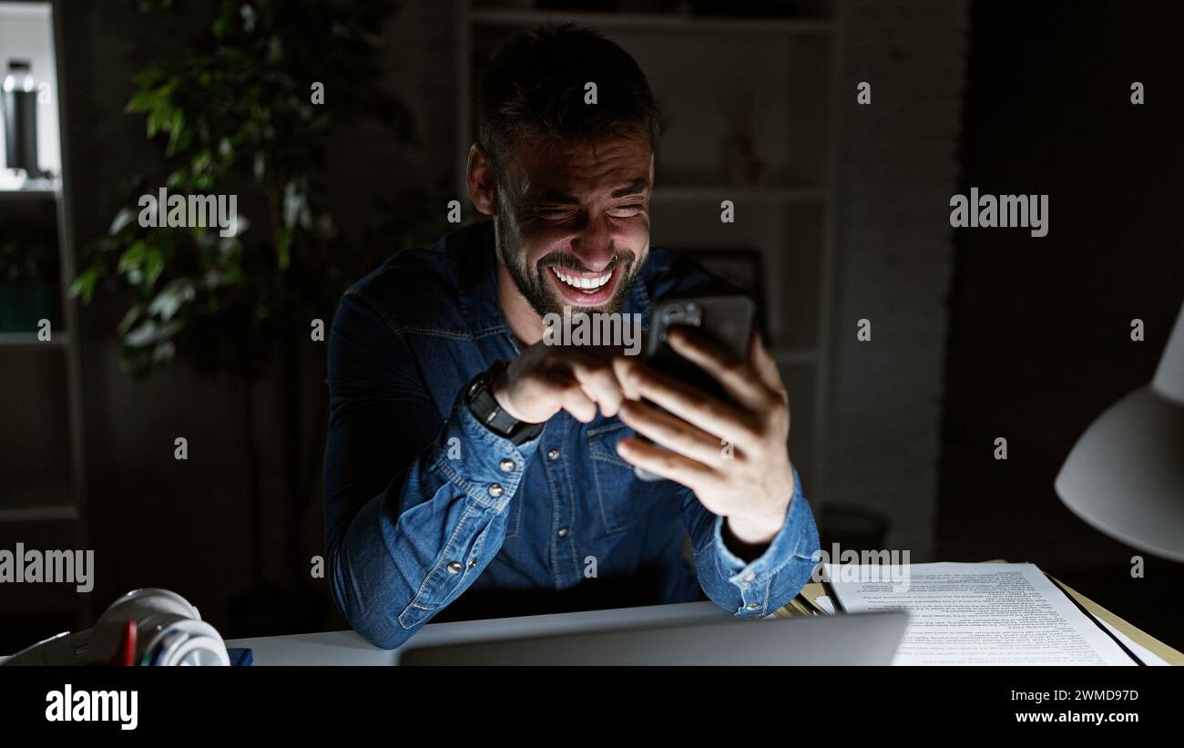 Confident young hispanic business man, smiling while working late into ...