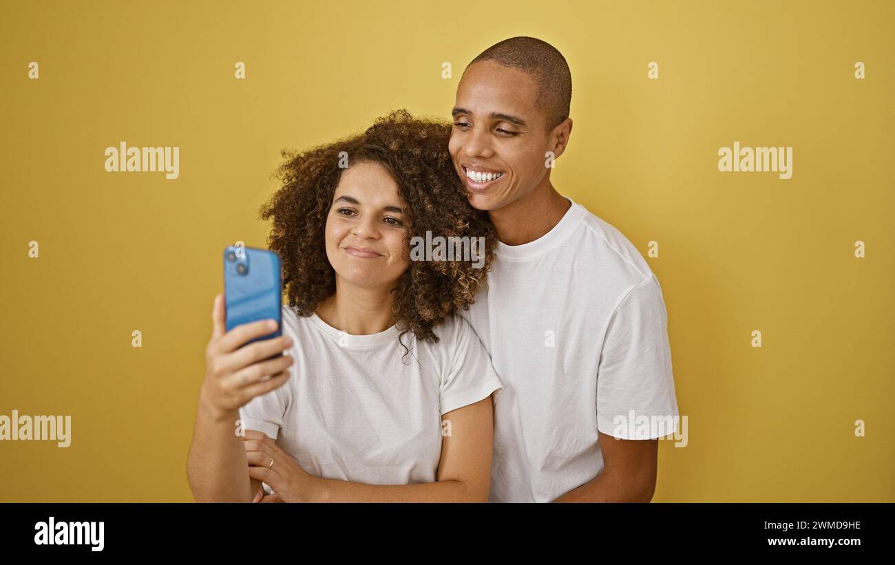 Confident beautiful couple, oozing joy, taking a smiling selfie on ...