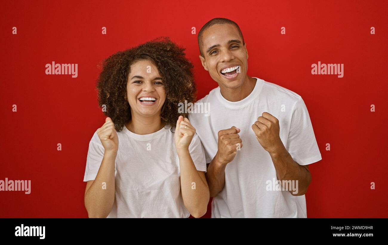 Joyful, confident couple celebrating their love, standing and smiling ...