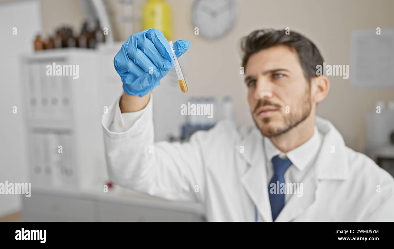 Hispanic scientist examines sample in hi-res stock photography and ...