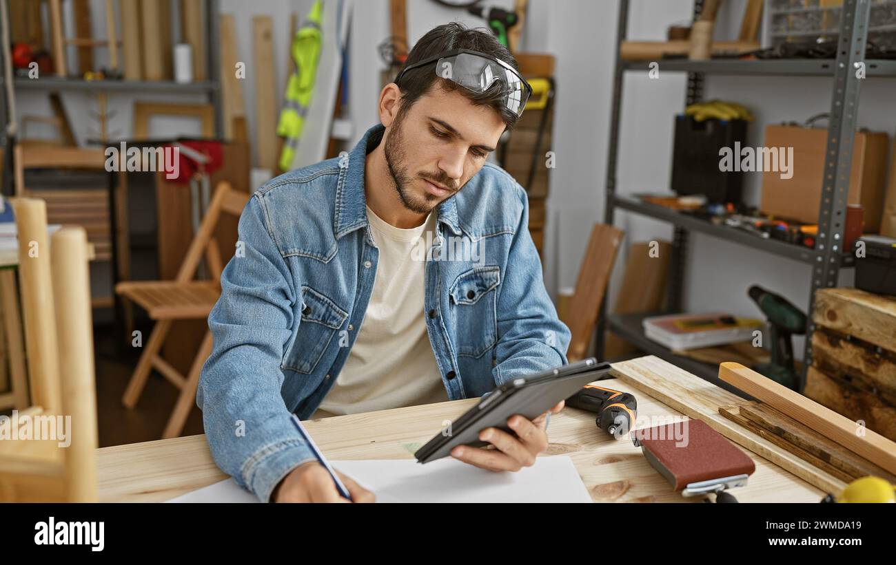 Handsome hispanic man planning hi-res stock photography and images - Alamy