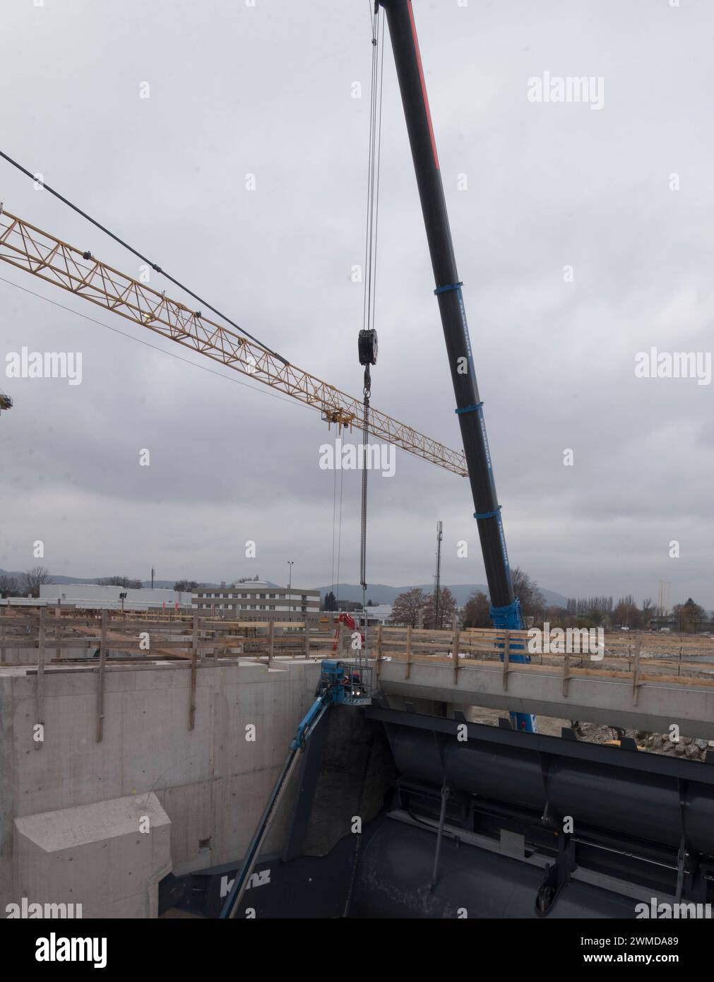 Construction crane in building industry, heavy machine at construction ...