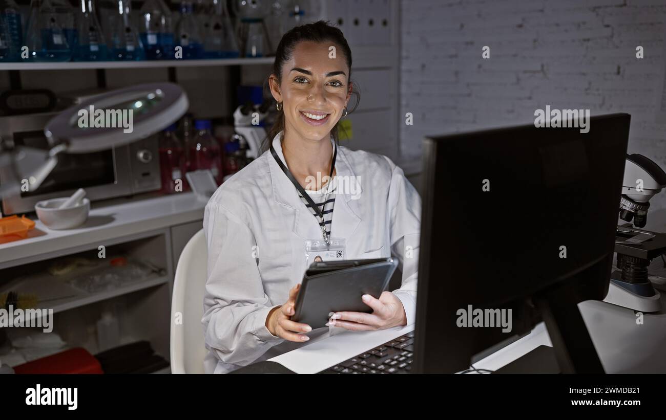 Smiling attractive young hispanic woman scientist, radiating with ...