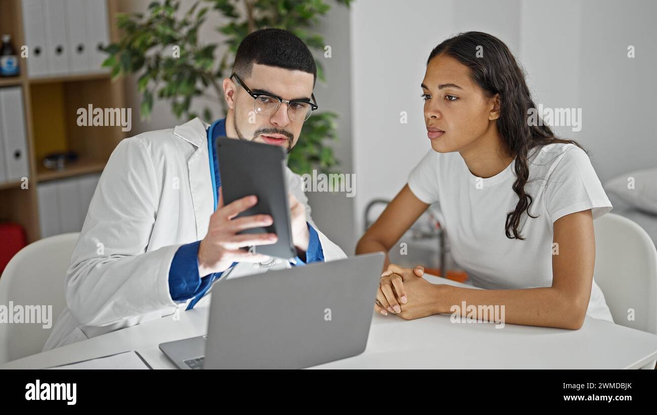 Touchpad conversation indoors, doctor and patient speak at the clinic ...