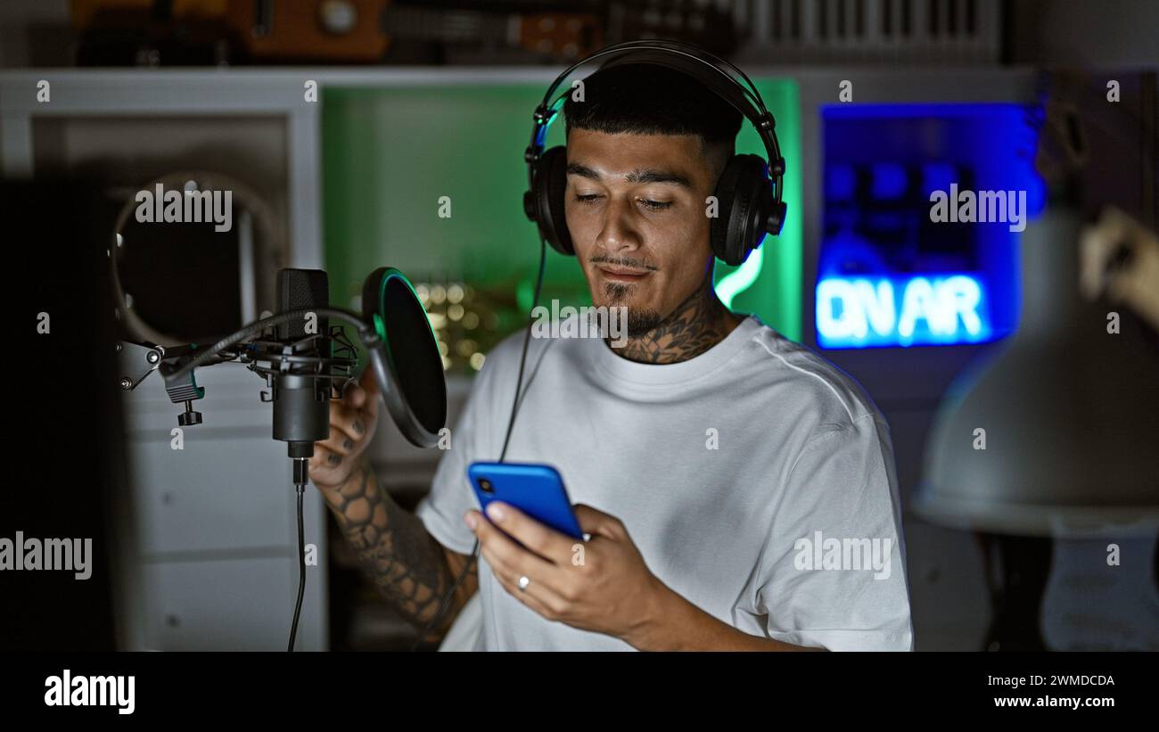Sizzling snapshot, tattooed, handsome latin musician lost in melody ...