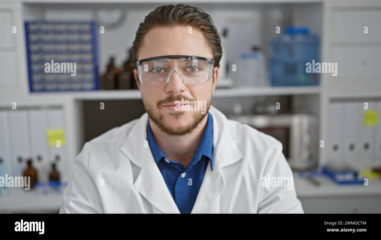 Young hispanic man scientist sitting on chair relaxed at laboratory Stock Photo - Alamy