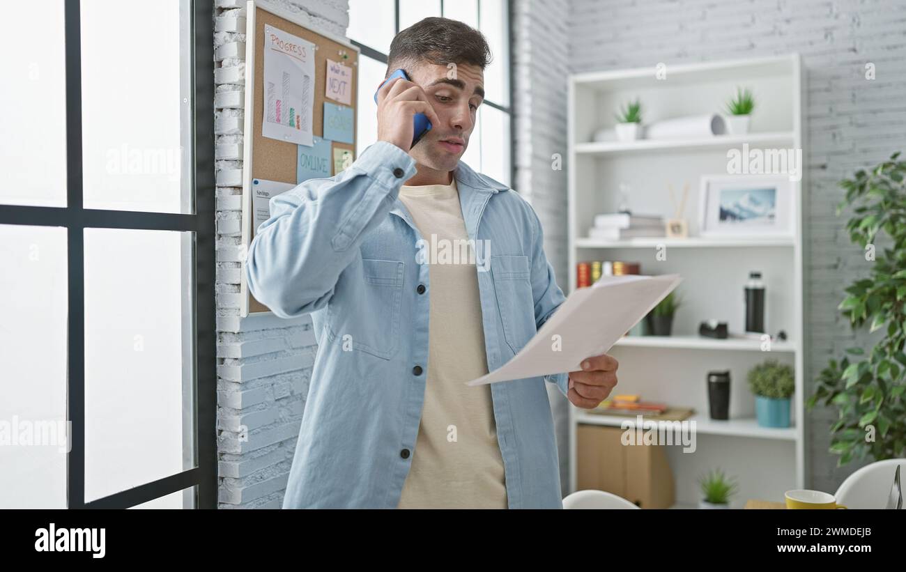 Hard-working young hispanic business pro balancing smartphone call ...