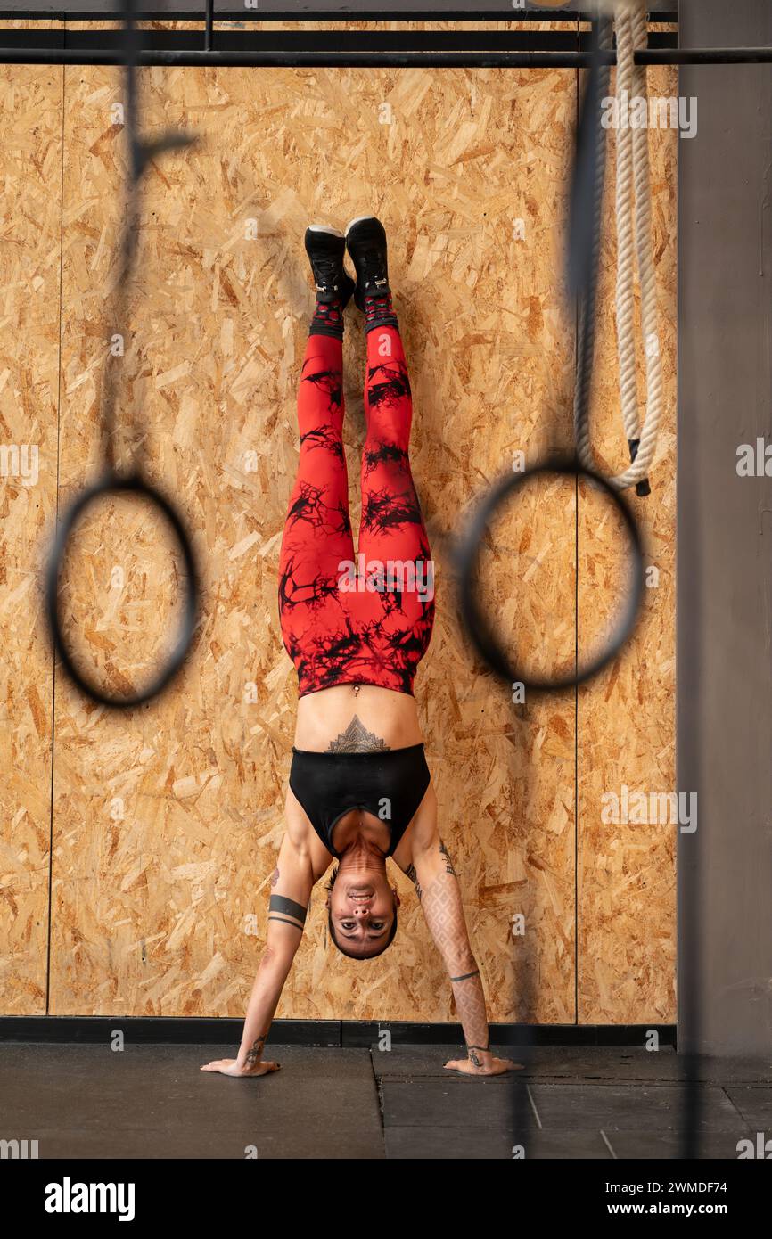 Woman performing handstand in hi-res stock photography and images - Alamy
