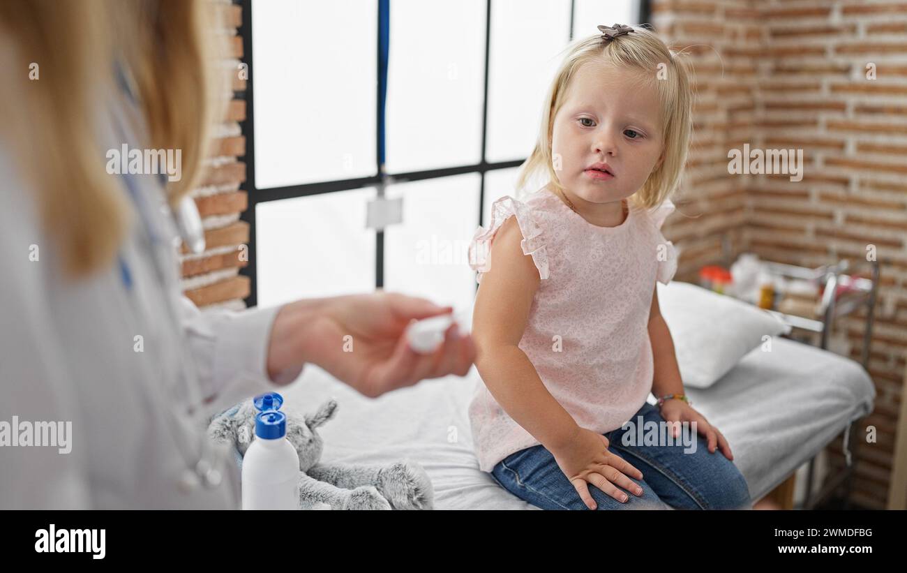 Caring doctor and brave little patient bonding during a critical ...