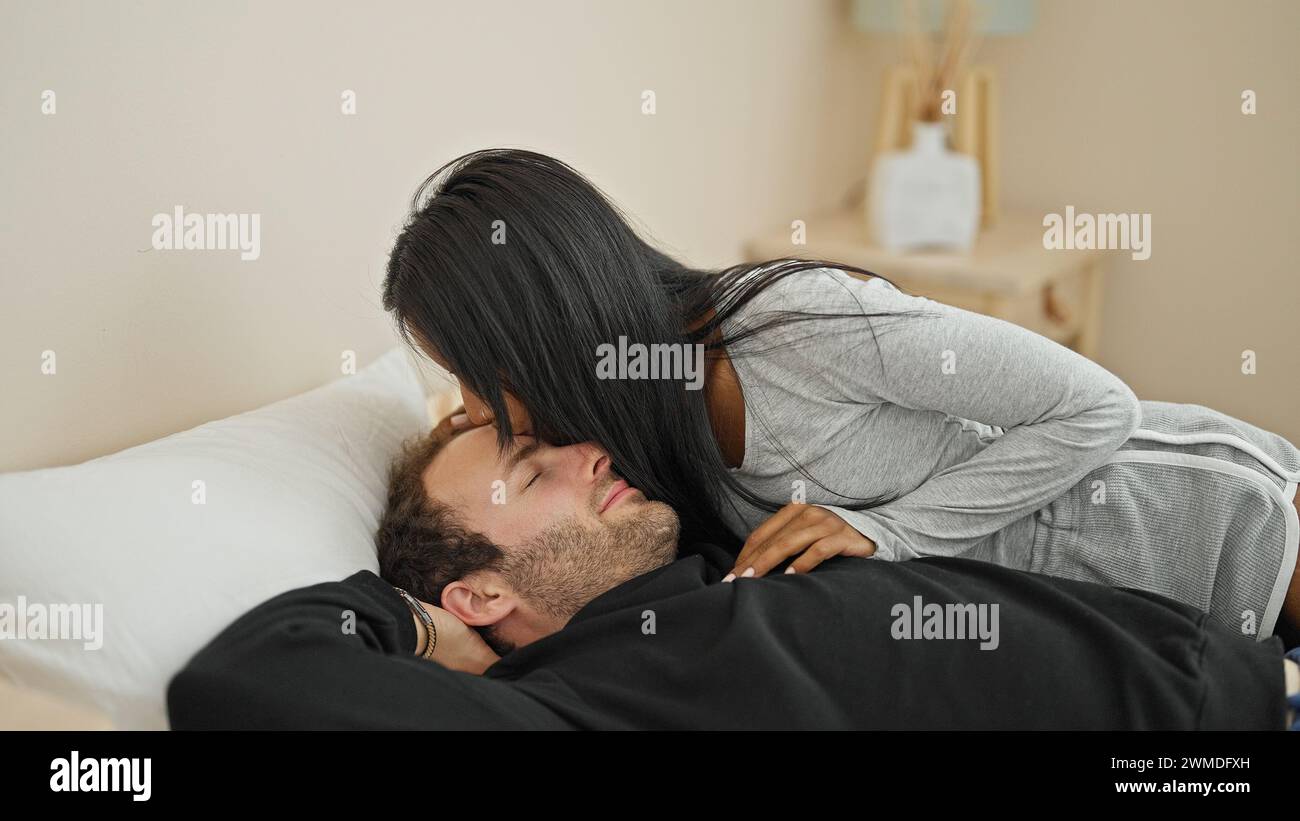Woman asleep man kiss bed hi-res stock photography and images - Alamy