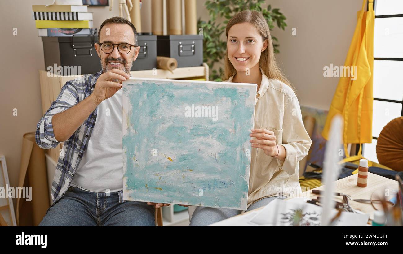 Two happy artists, smiling confidently, sharing a moment of creativity ...