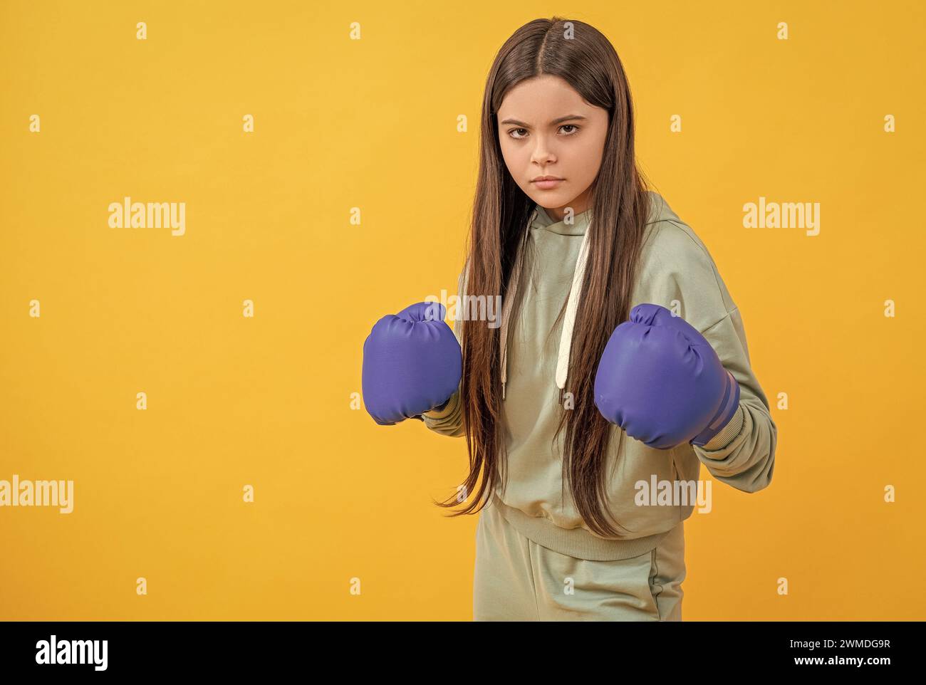serious teen boxing girl on background. photo of teen boxing girl ...