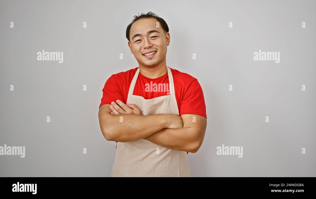Confident young chinese man, smiling waiter with arms crossed, standing ...
