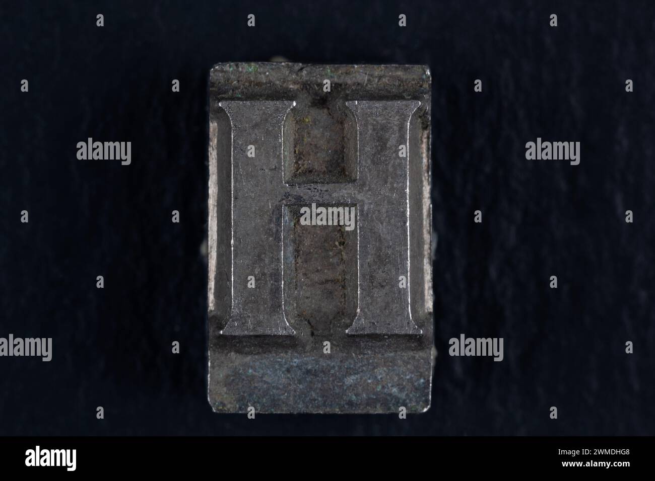 Antique vintage movable type alphabet letter H on black background ...