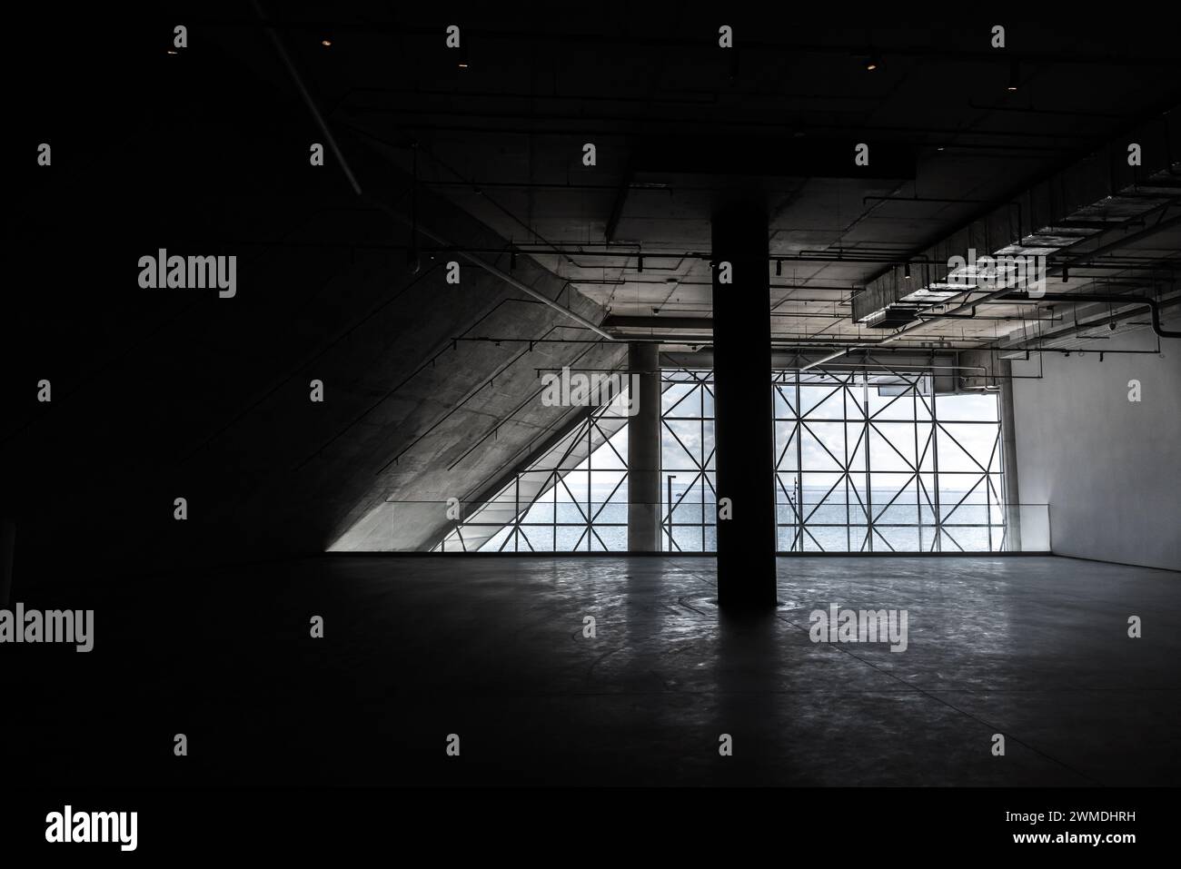 Abstract dark industrial interior background with concrete pillars in ...