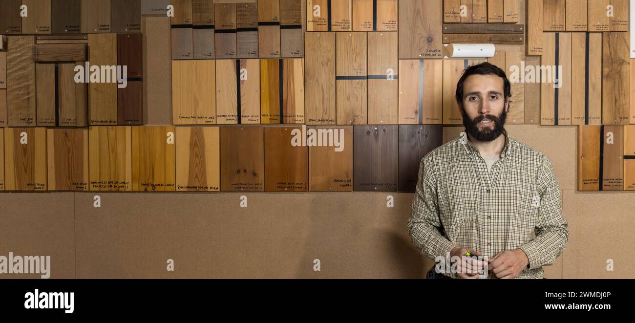 Horizontal photo a bearded woodworker mid adult caucasian stands ...
