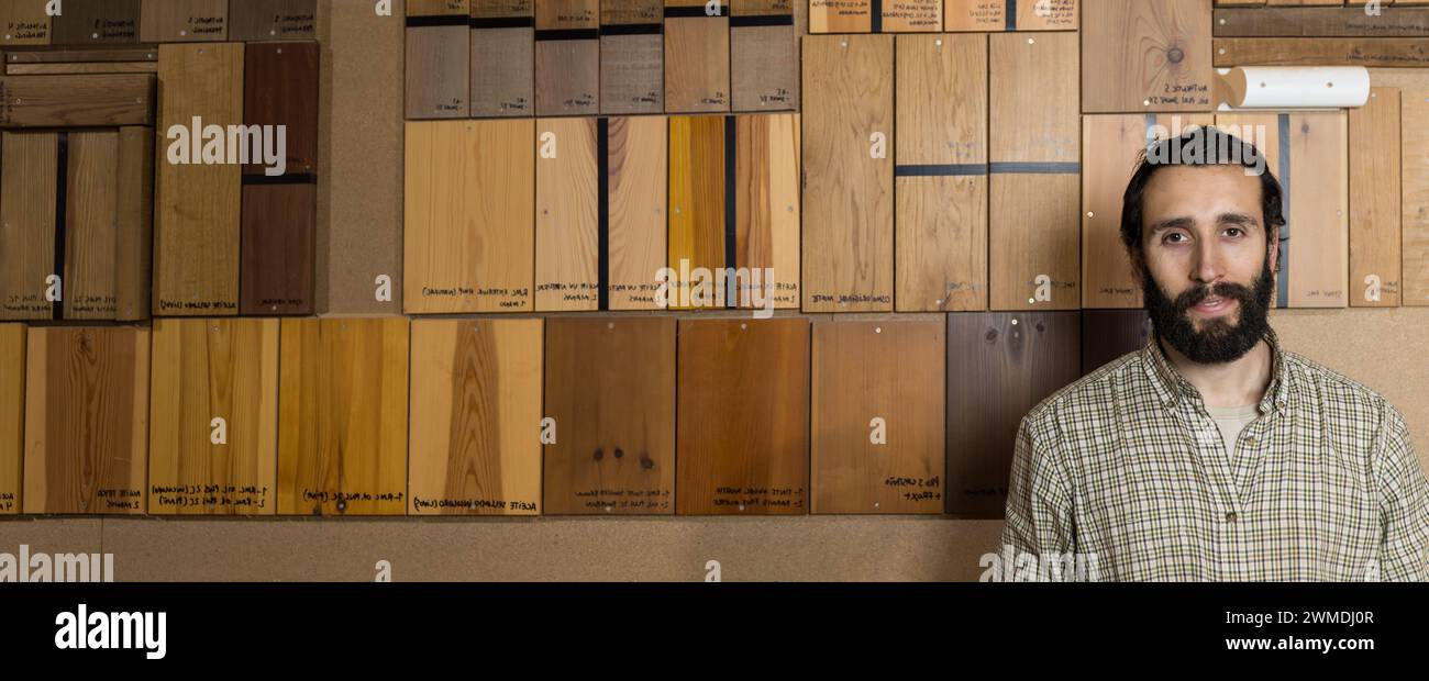 Horizontal photo a thoughtful carpenter mid adult caucasian stands ...