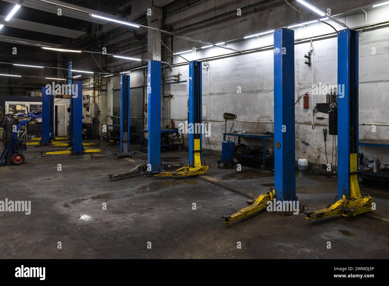 Empty concrete car service interior with vacant car lifts Stock Photo ...