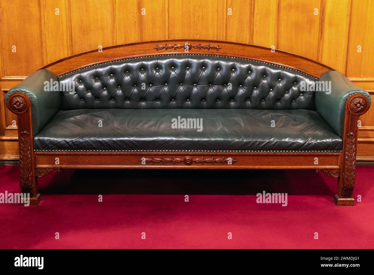 Luxury vintage sofa with green genuine leather seat and carving ...