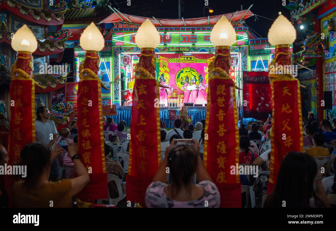 People watch Chinese opera performance during the birthday celebration ...