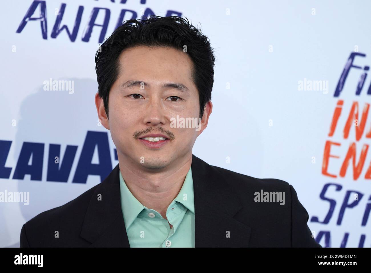 Steven Yeun arrives at the Film Independent Spirit Awards on Sunday ...