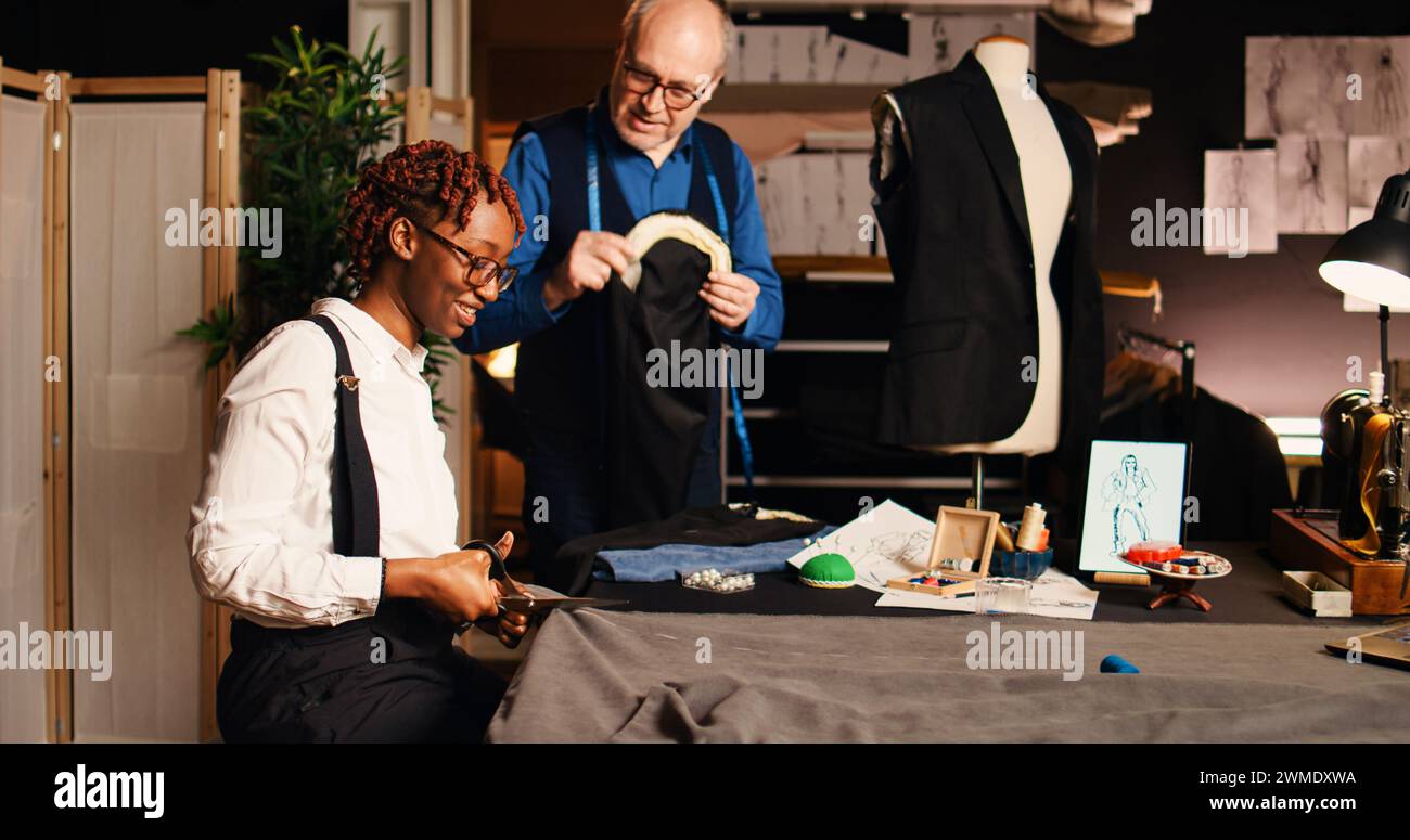 Tailor student cutting fabric hi-res stock photography and images - Alamy