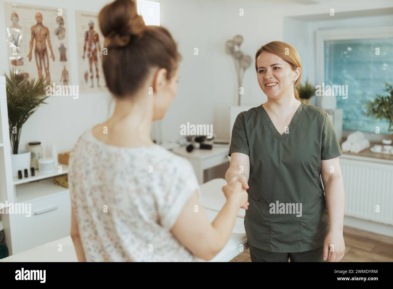 Healthcare Time Happy Female Medical Massage Therapist In Massage