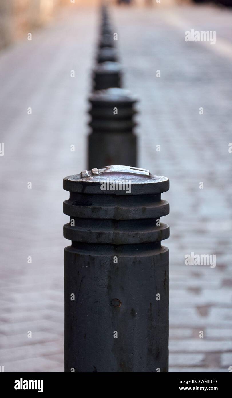 A street scene capturing a row of bollards Stock Photo - Alamy