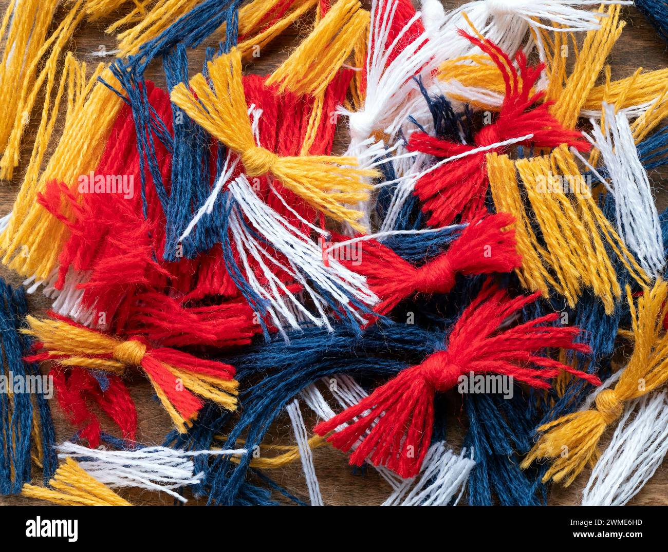 Colored threads with knots, remnants from weaving, selective focus ...
