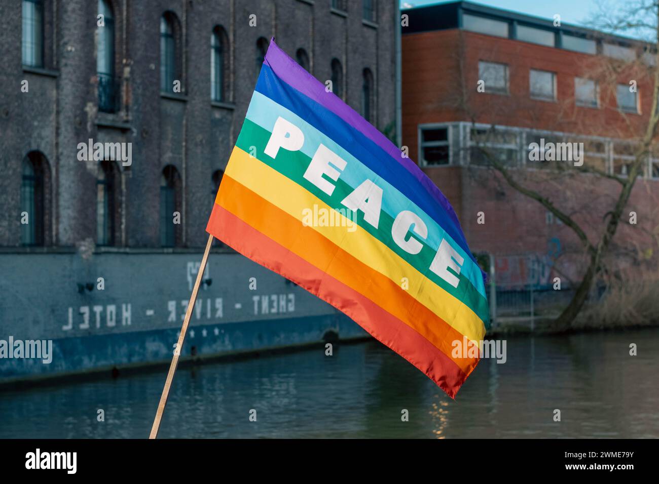 rainbow colored flag with peace written on it. world peace and no war ...