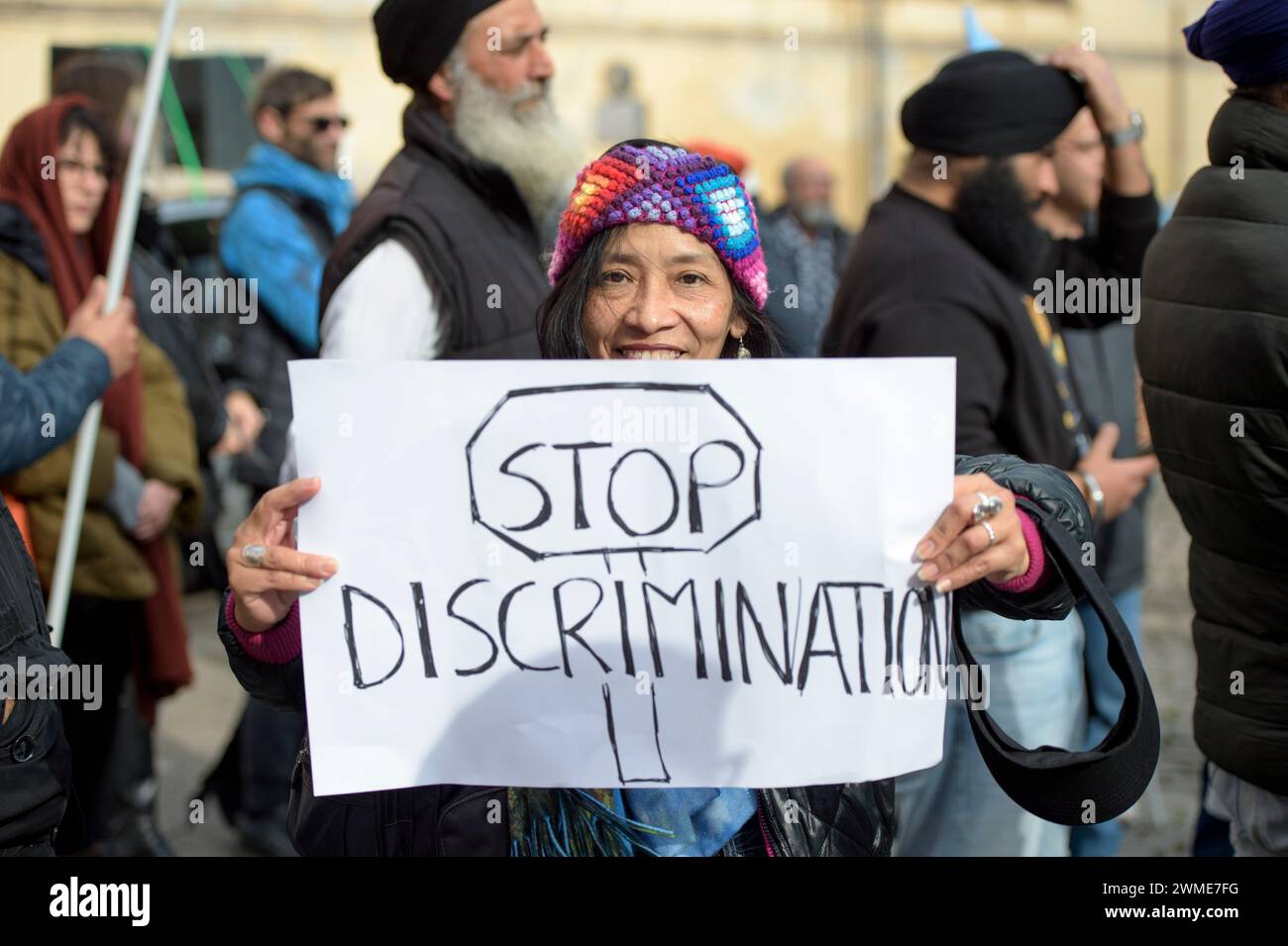 Rome, Italy. 25th Feb, 2024. An immigrant woman shows a sign with the ...