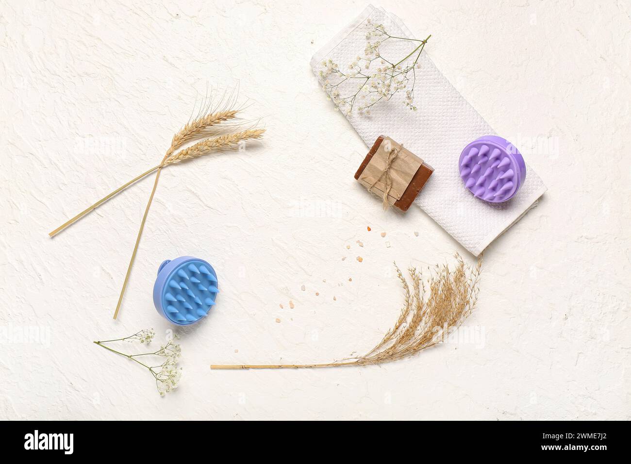 Hair scalp massagers with shampoo bar, towel and wheat spikelets on ...