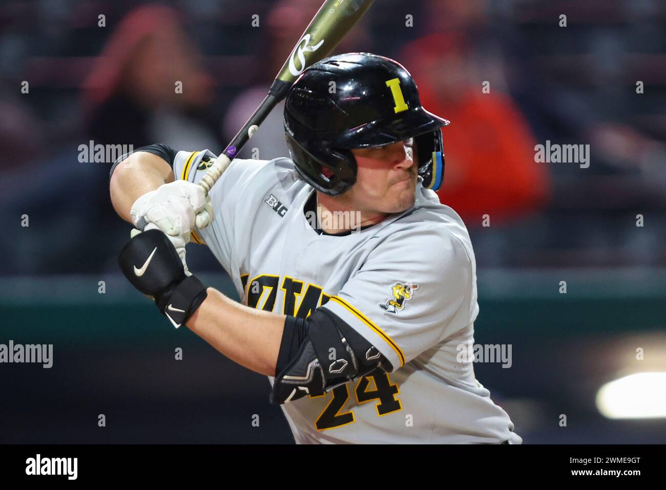 Iowa catcher Davis Cop (24) bats during an NCAA baseball game against ...