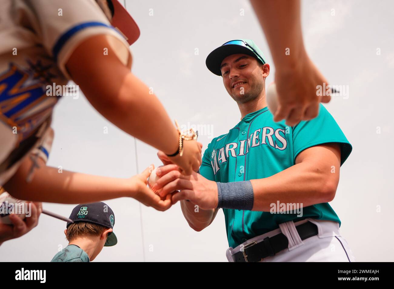 Seattle Mariners right fielder Dominic Canzone signs autographs before ...